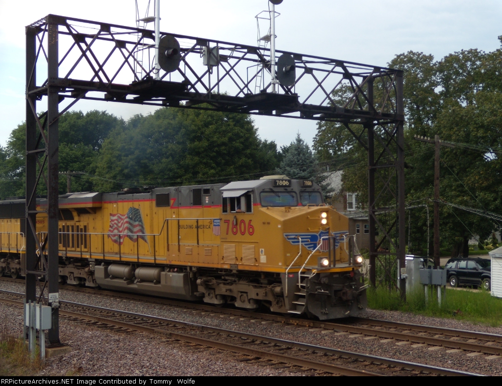 UP 7806 leads an intermodal as it passes beneth the UP signal bridge at Rochelle